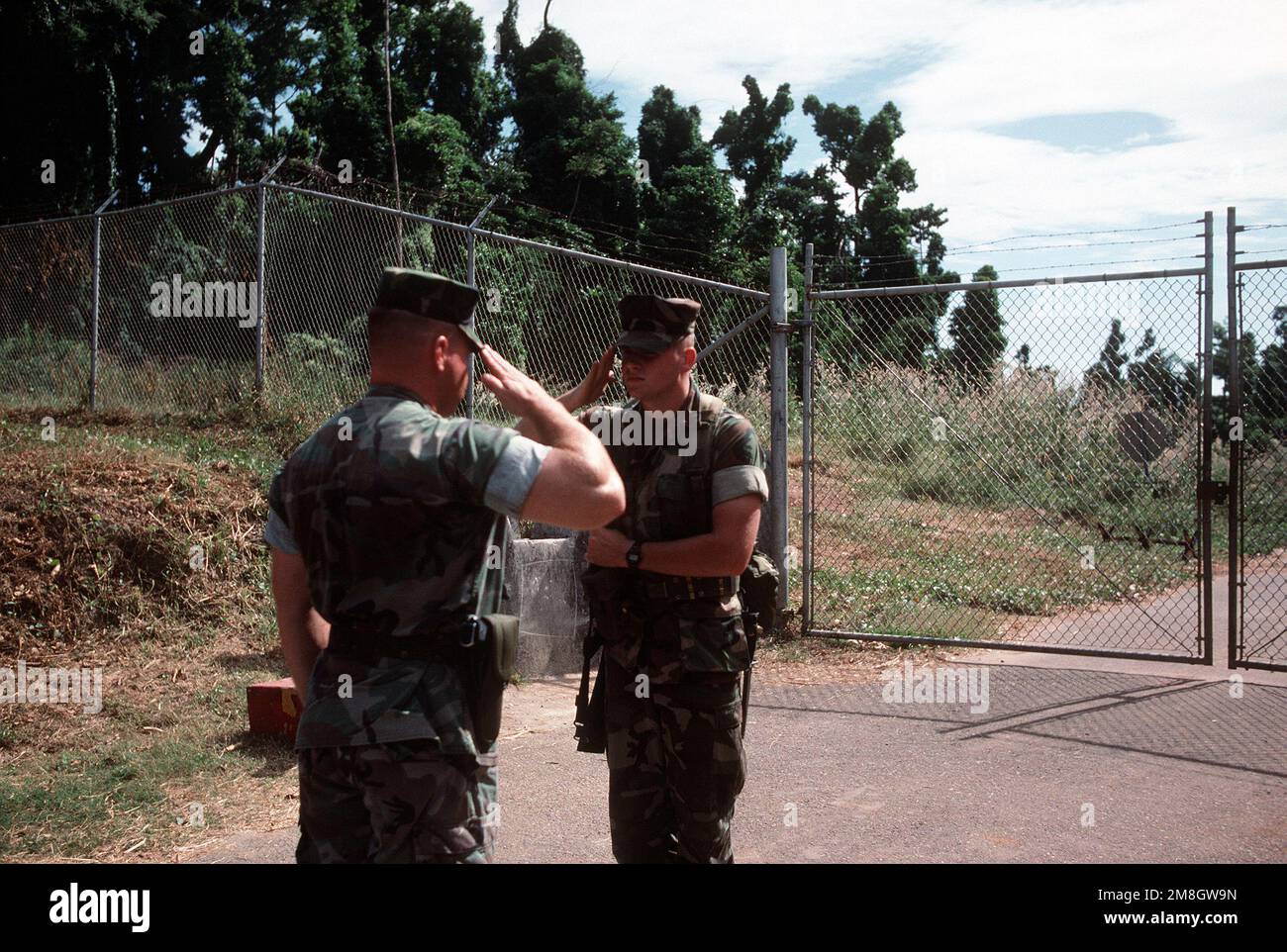 Marine guards salute as they change posts at the U.S. Naval Magazine. A ...