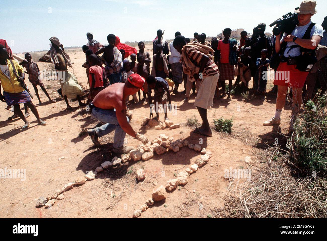 In support of Operation Provide Relief, MSGT Gary Bushnell (no shirt on ...