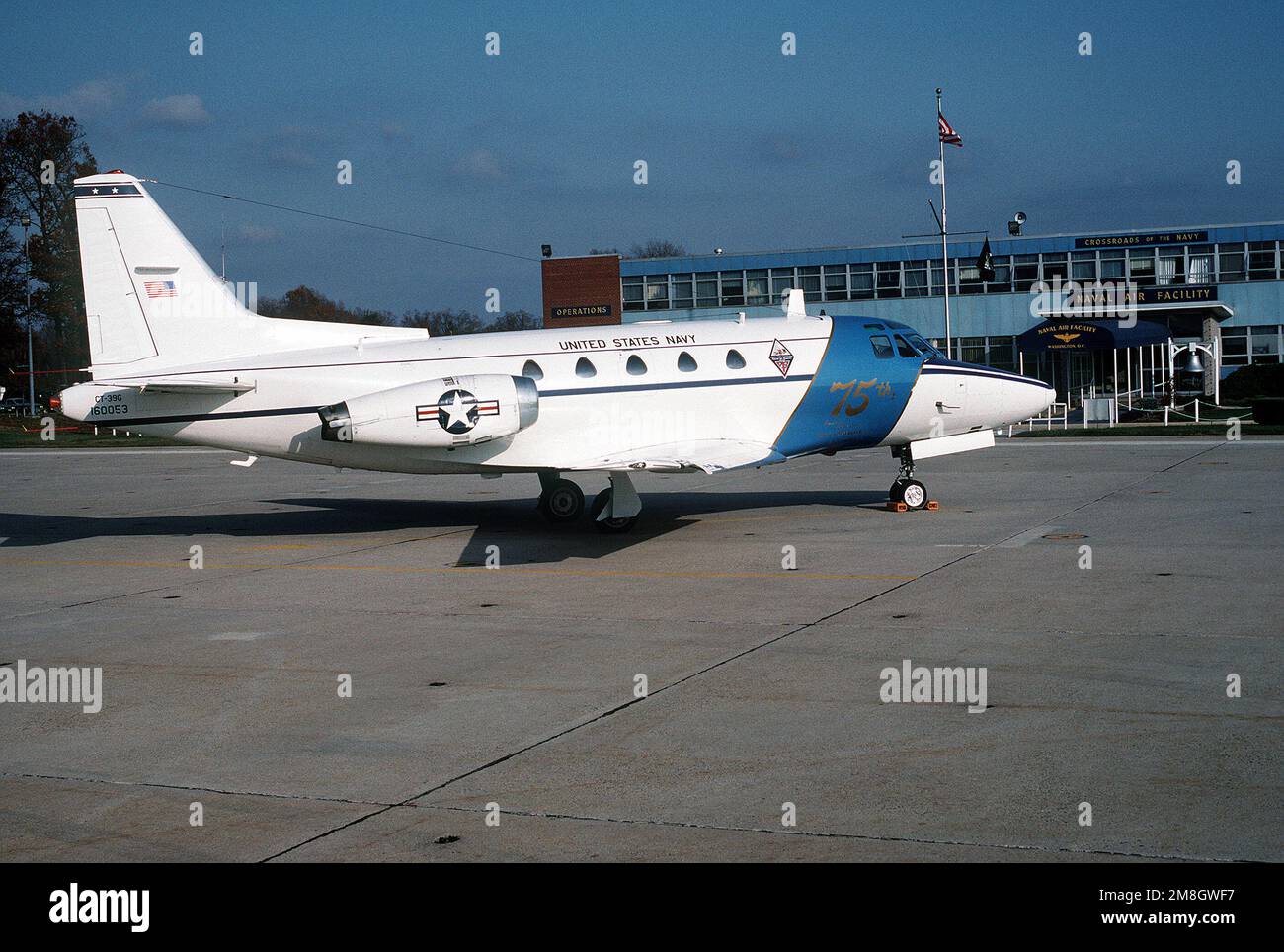 A right side view of a CT-39G Sabreliner aircraft parked in front of ...
