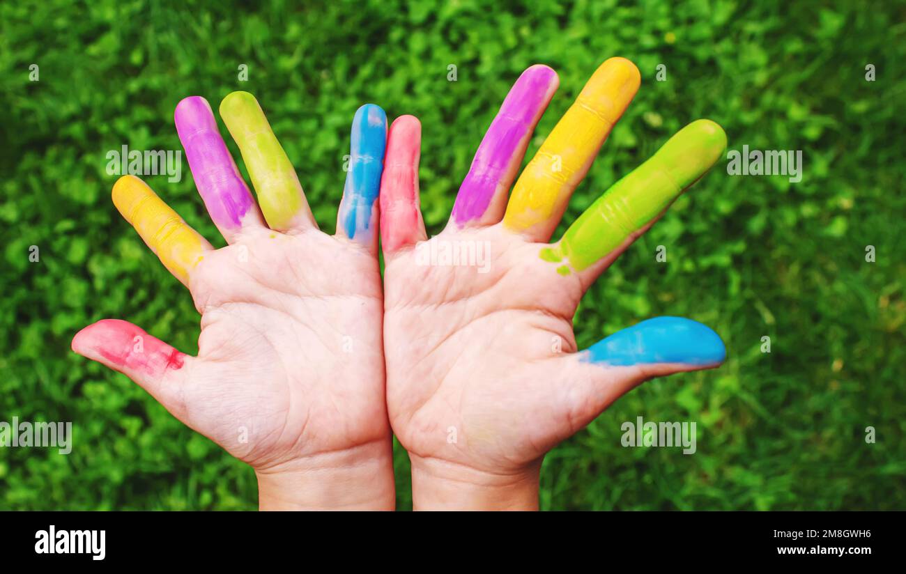 Children's hands in the colors of summer. Selective focus.arts Stock ...
