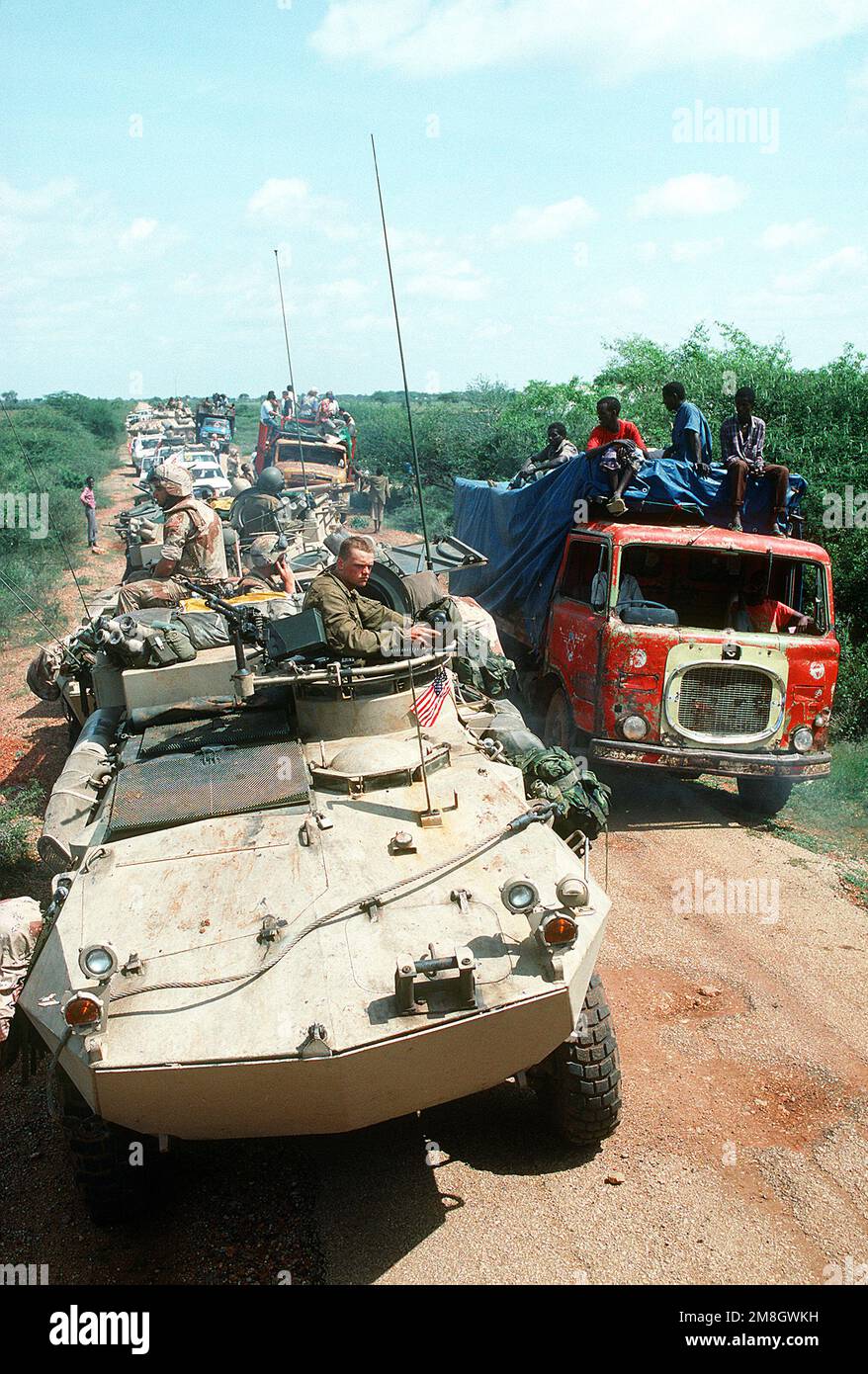 Marines in a Light Armored Vehicle (LAV) escort a convoy of civilian ...