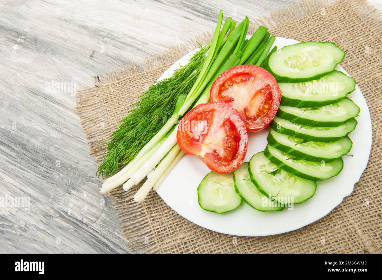 White plate sliced vegetables hi-res stock photography and images - Alamy