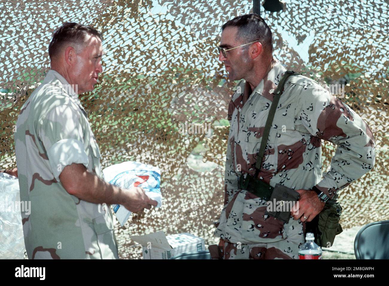 GEN Carl E. Mundy Jr., commandant of the Marine Corps, talks with an ...