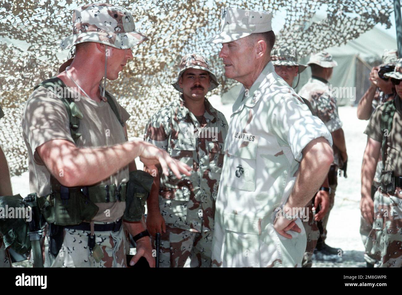 GEN Carl E. Mundy Jr., commandant of the Marine Corps, talks with a ...