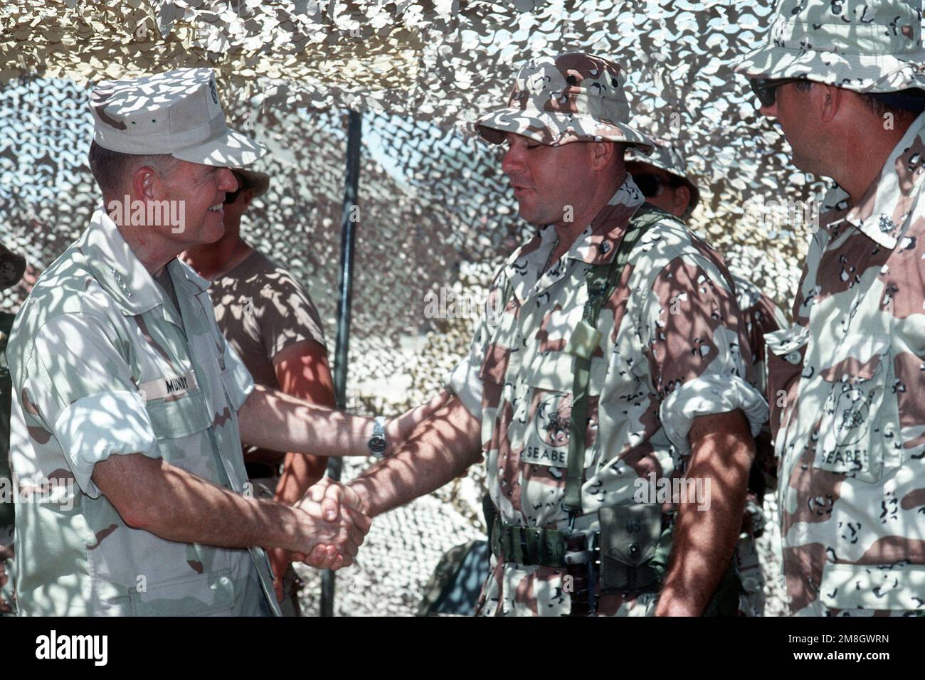 GEN Carl E. Mundy Jr., commandant of the Marine Corps, congratulates a ...