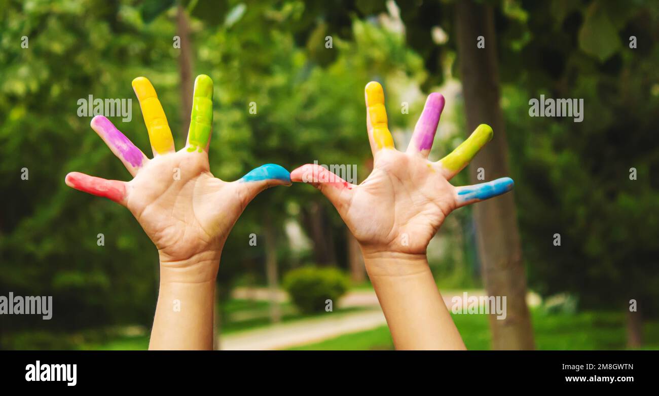 Children's hands in the colors of summer. Selective focus.arts Stock ...