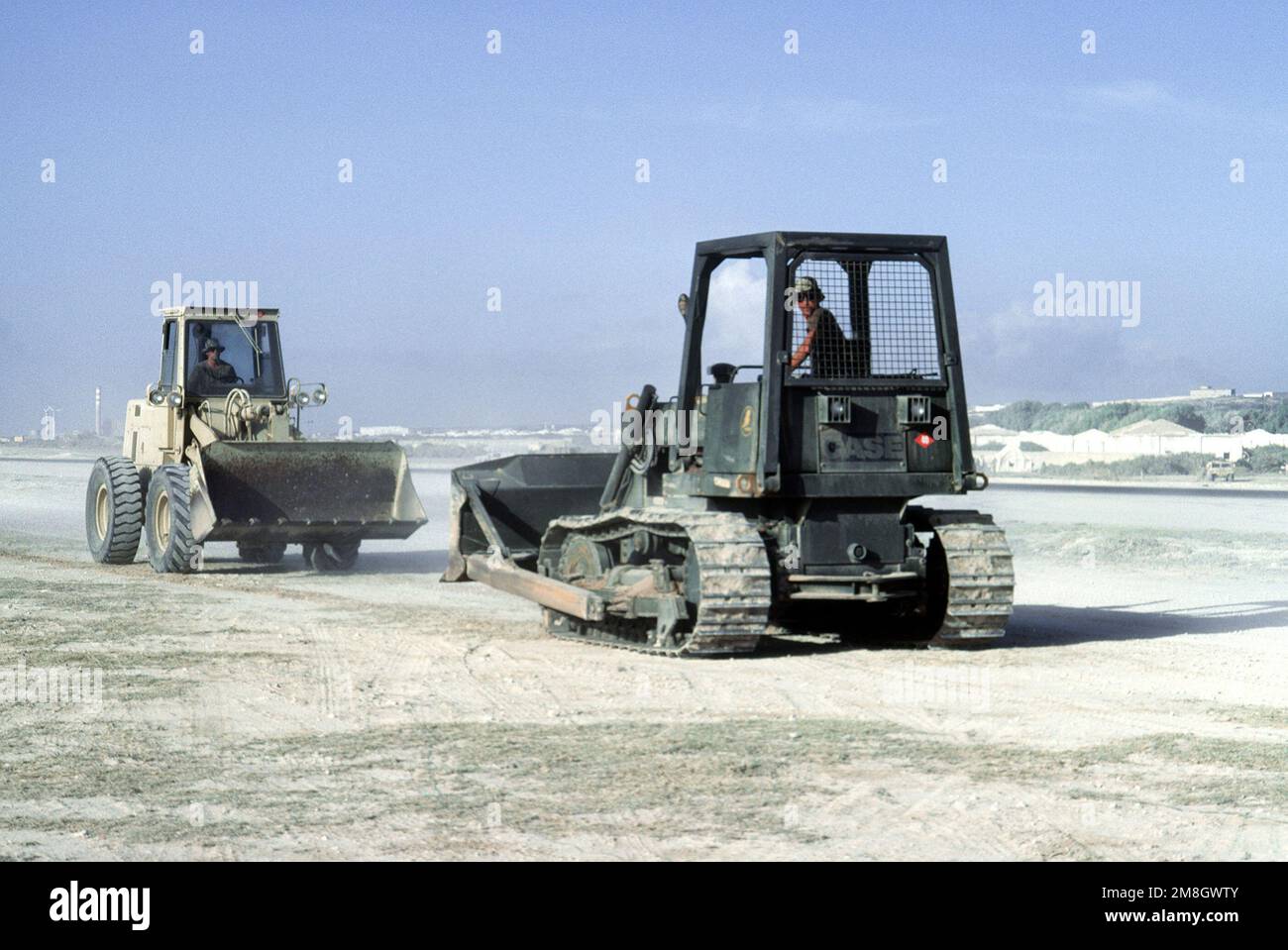 A front-end loader and a bulldozer of Naval Mobile Construction ...