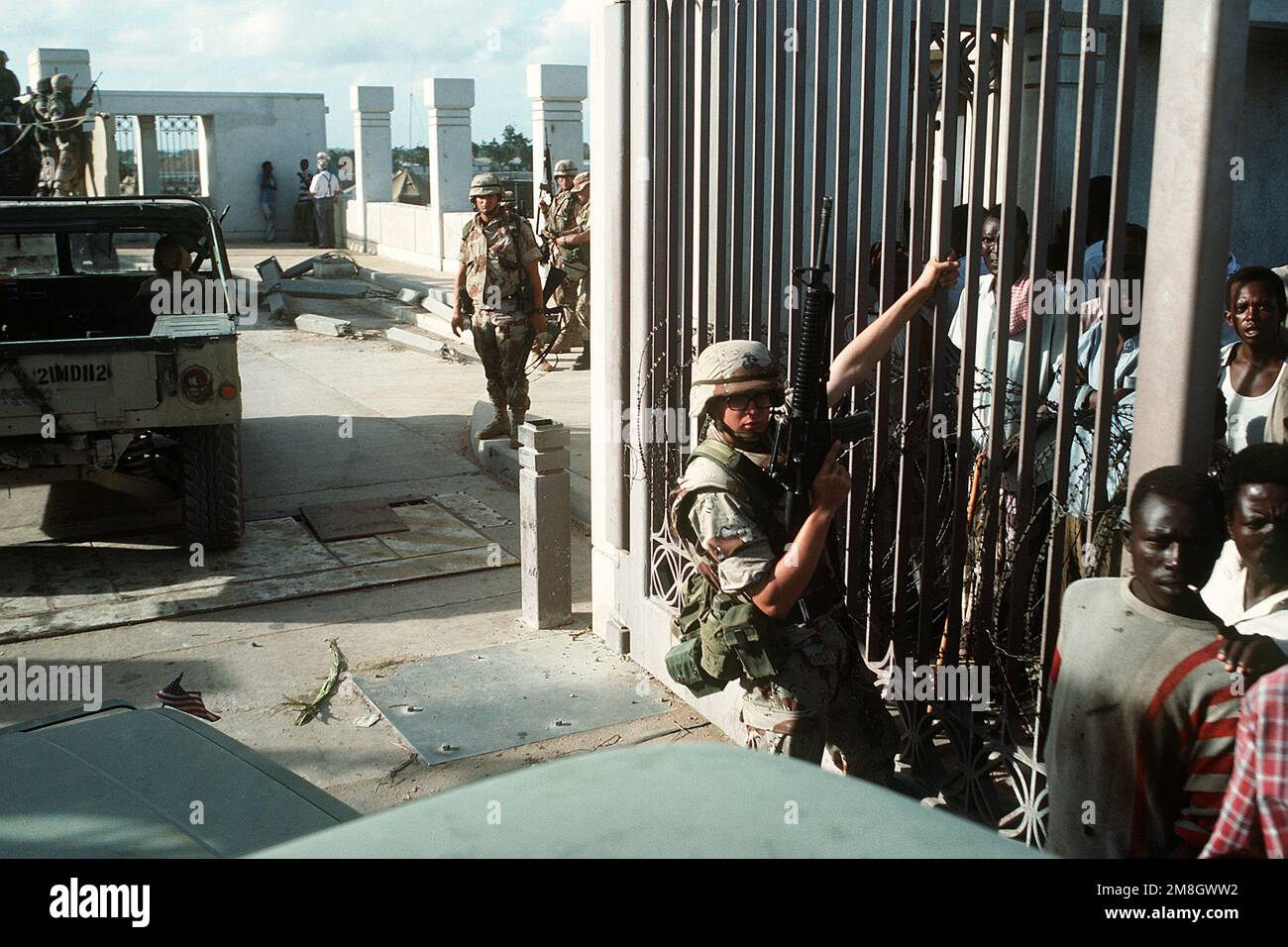 A Marine sentry prepares to close the gate to the Joint Task Force ...