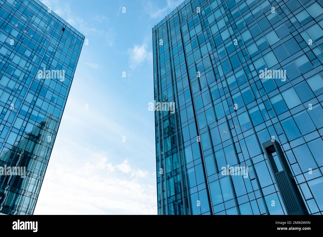 The geometry of modern urban architecture is reflected in the glass ...