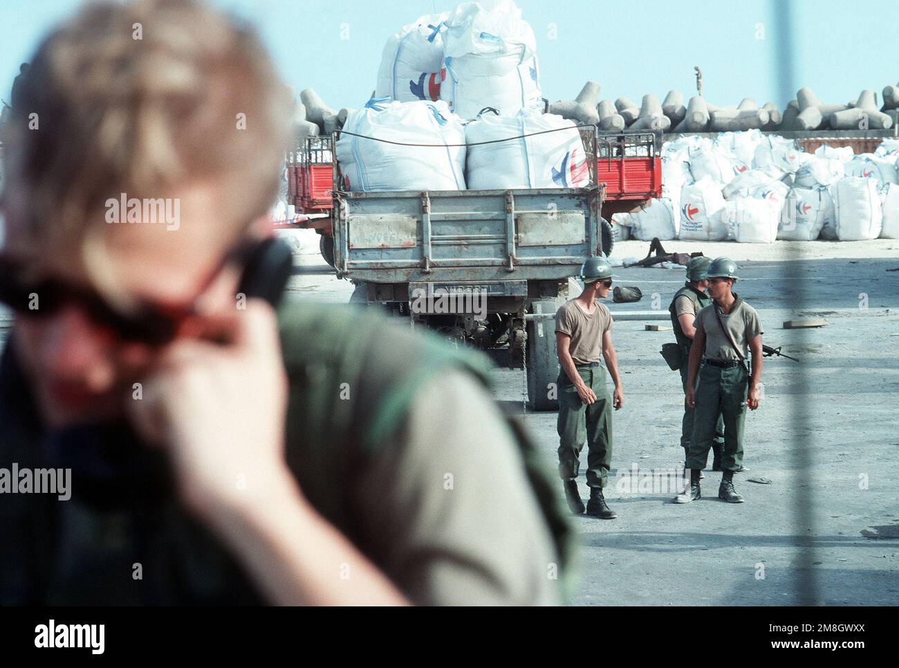 A civilian truck, carrying relief supplies donated by France, drives ...