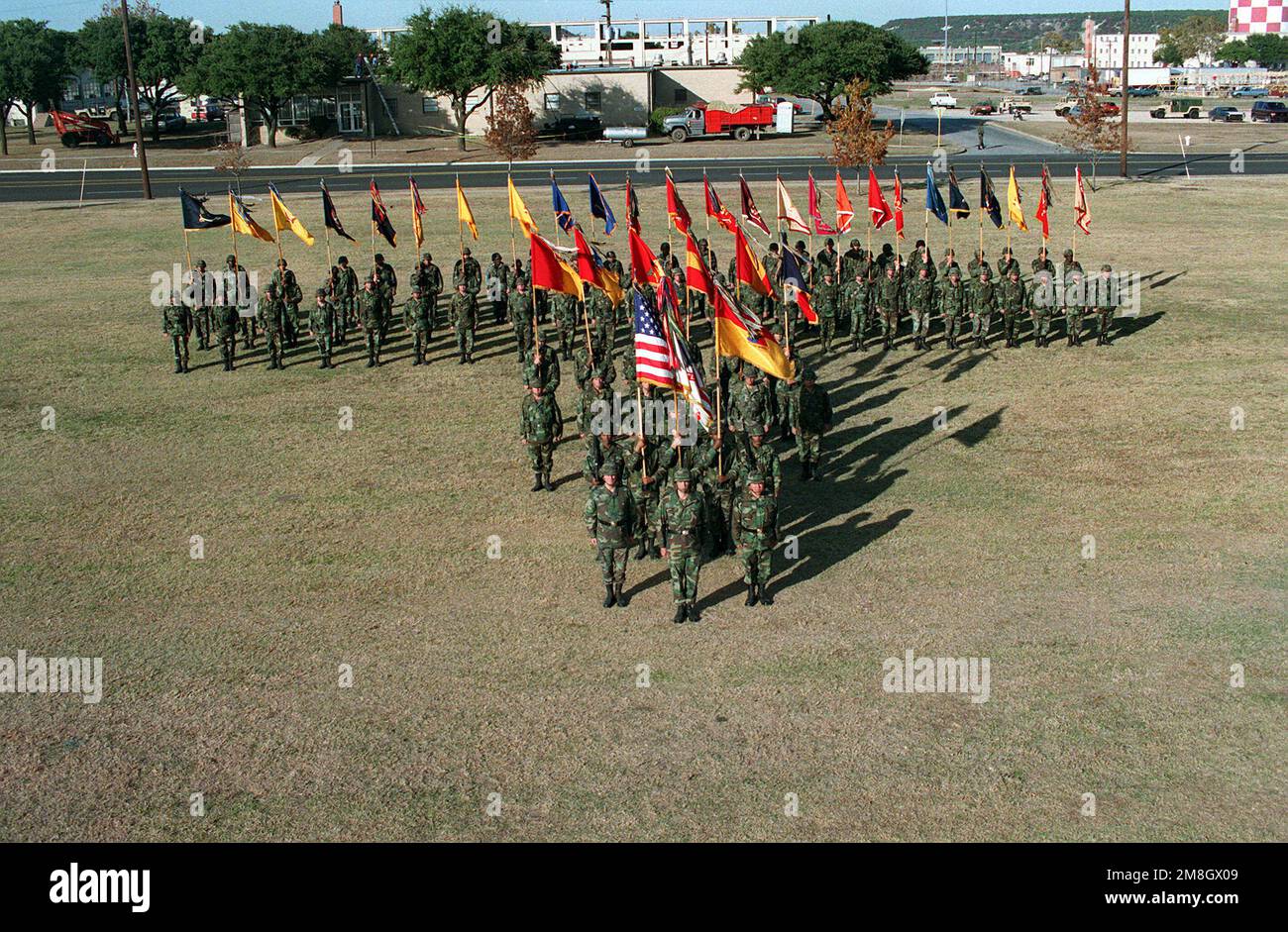 Soldiers of the 2nd Armored Division stand in formation as they display ...