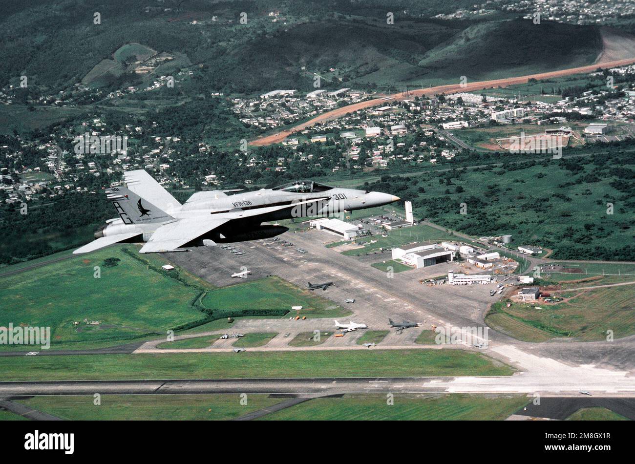 An air-to-air right side view of a Strike Fighter Squadron 136 (VFA-136 ...