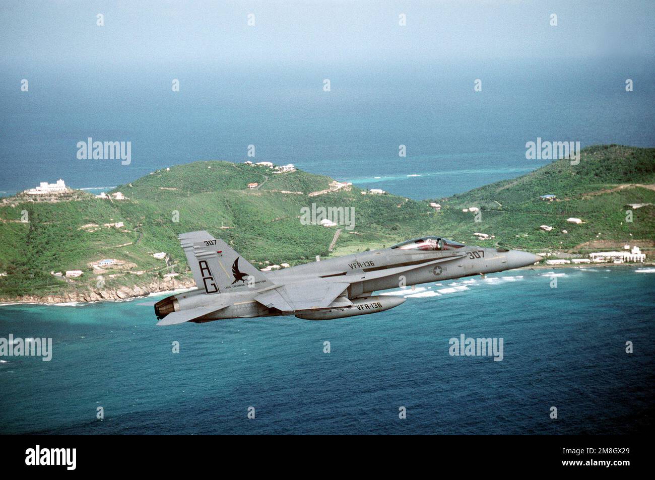 An air-to-air right side view of a Strike Fighter Squadron 136 (VFA-136 ...