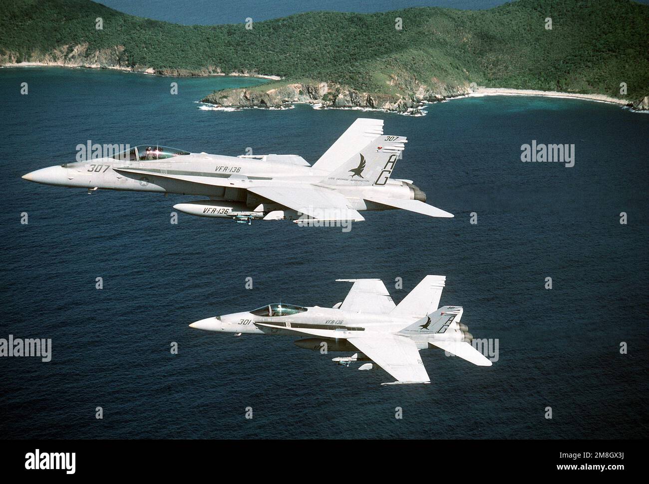 An air-to-air left side view of Strike Fighter Squadron 136 (VFA-136) F ...
