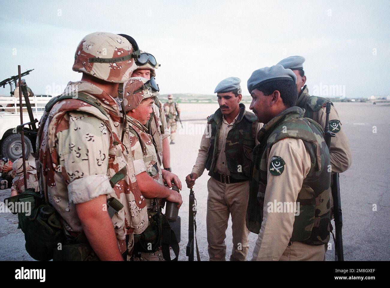 U.S. Marines converse with Pakistani military personnel at Mogadishu ...