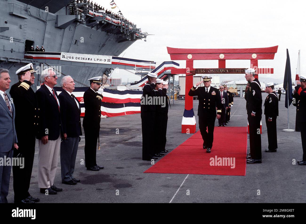 Sideboys salute as RDML William E. Terry arrives for the ...