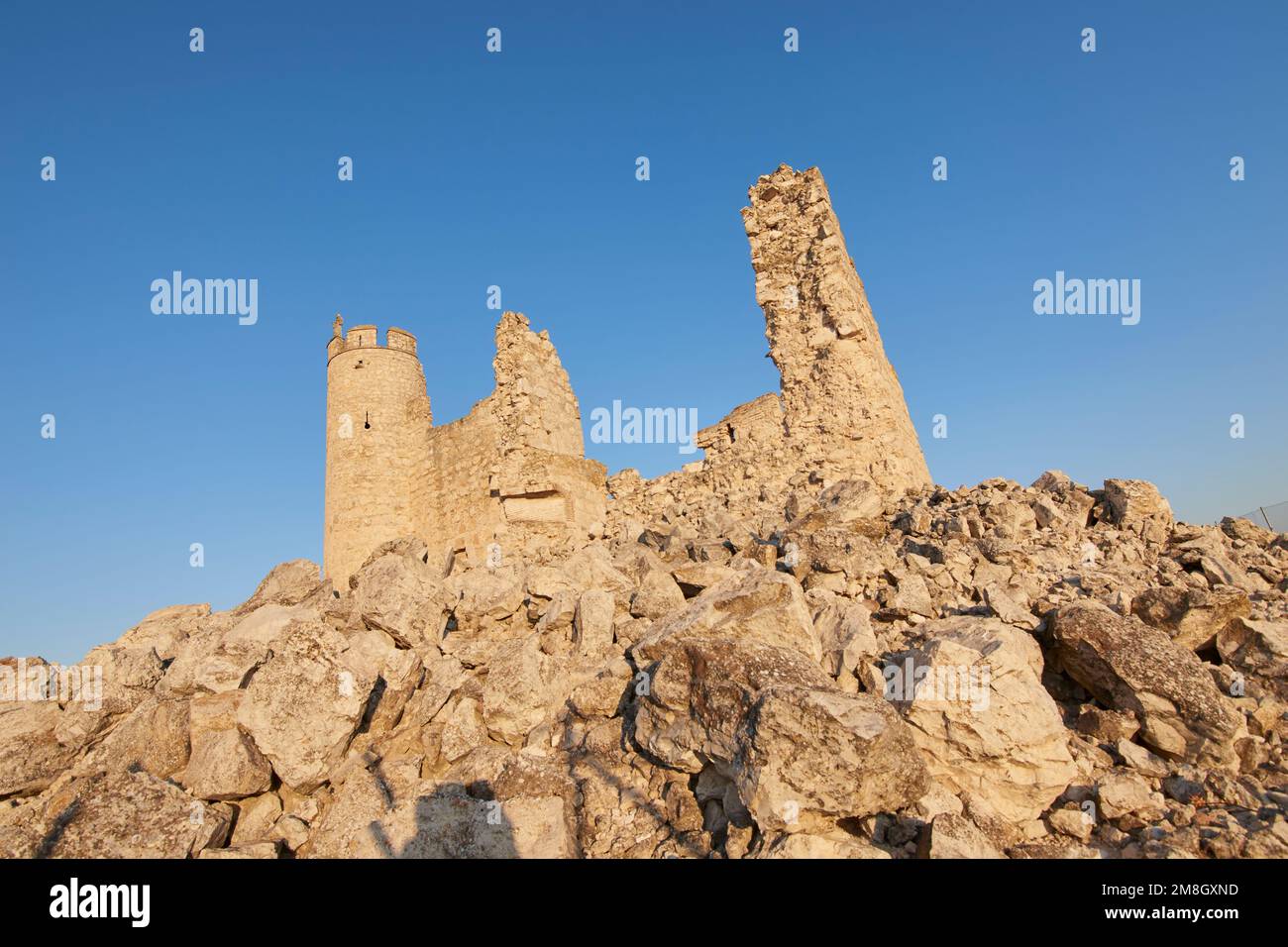Caudilla castle in ruins in a sunny field at sunset in spring.Toledo ...