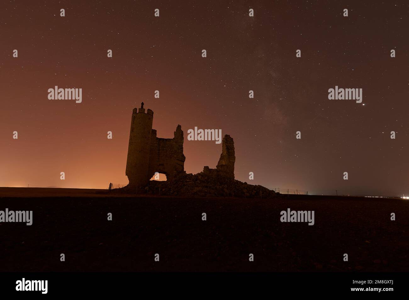 Caudilla castle in ruins in the countryside at night with the Milky Way ...