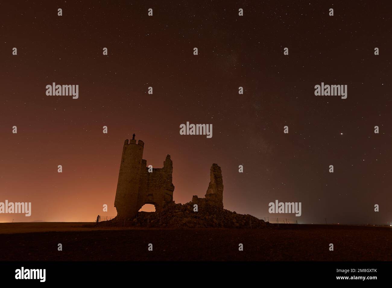 Caudilla castle in ruins in the countryside at night with the Milky Way ...