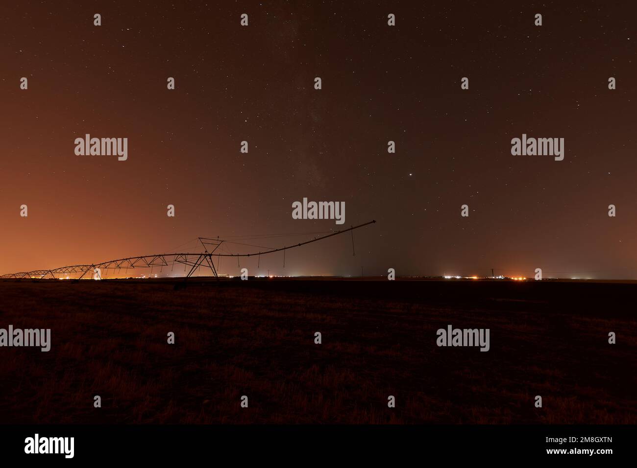 Irrigation system in field at night with the Milky Way in the fields of ...