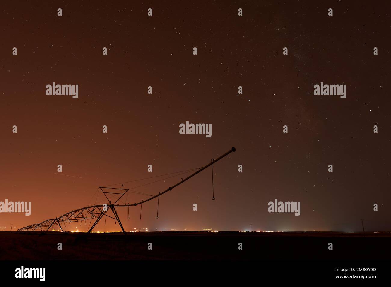 Irrigation system in field at night with the Milky Way in the fields of ...