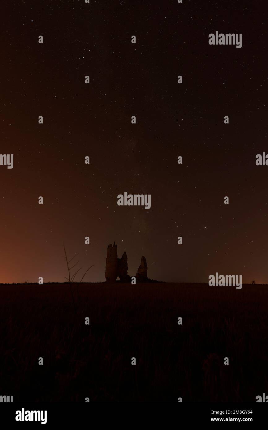 Caudilla castle in ruins in the countryside at night with the Milky Way ...