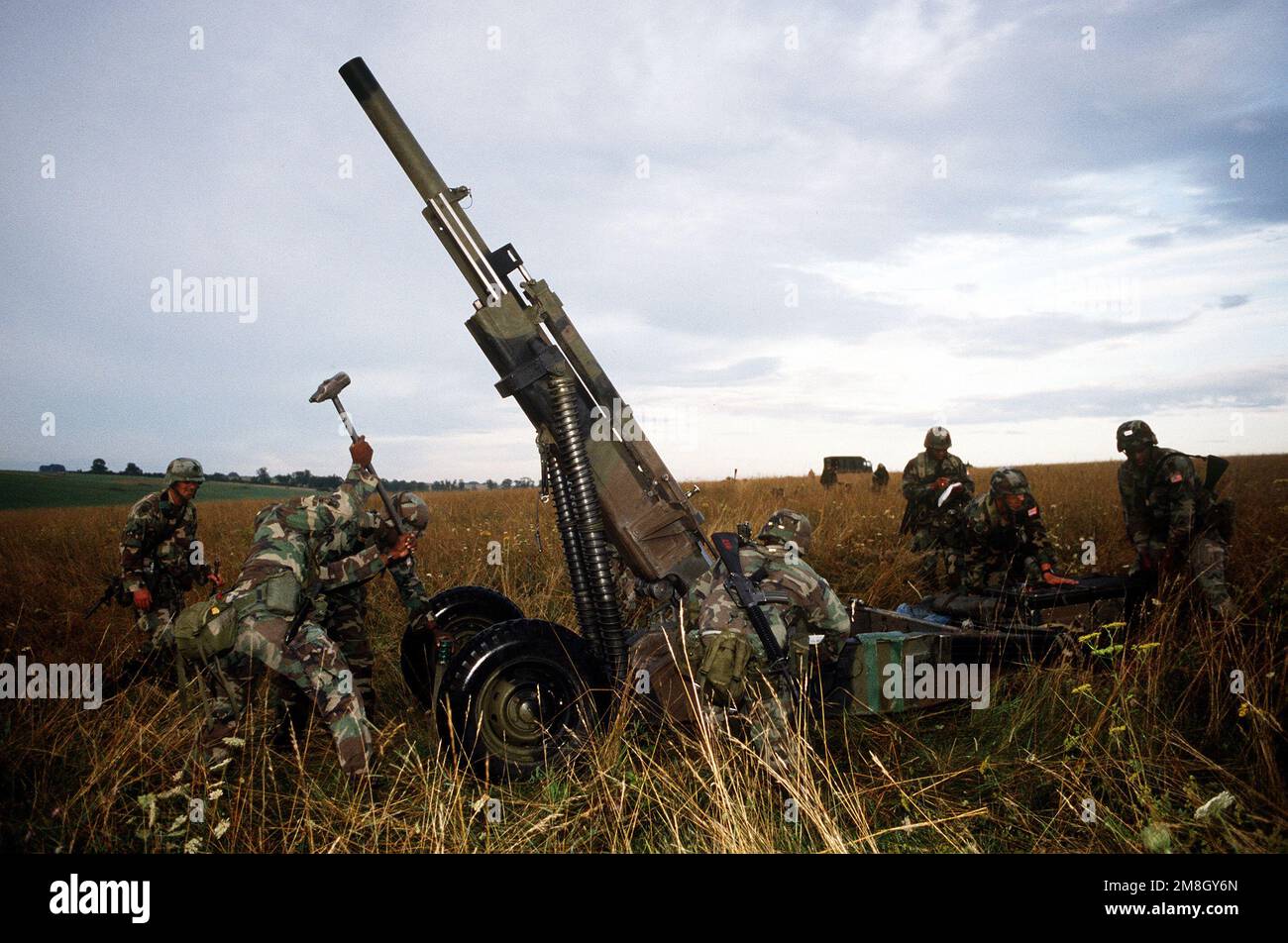 Soldiers from the 3rd Battalion 325th Infantry Regiment set up an 105mm ...