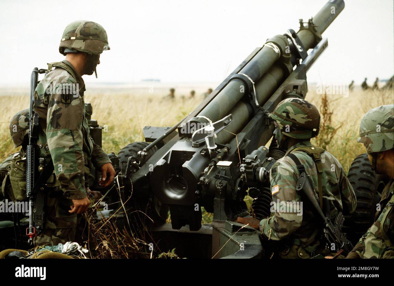 Soldiers from the 3rd Battalion 325th Infantry Regiment set up an 105mm ...
