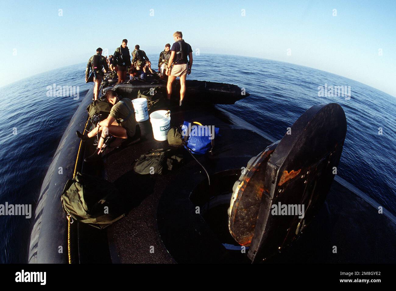 Members of SEAL Team One are shown on the aft section of the nuclear ...