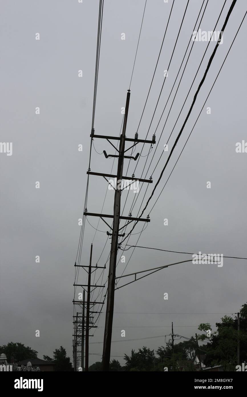 A typical power tower with wires crossing the overcast sky Stock Photo ...