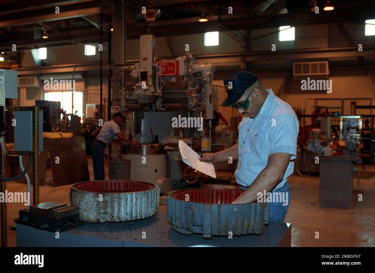 Machine Repairman Fireman (MRFN) Fields checks the demensions on a ...