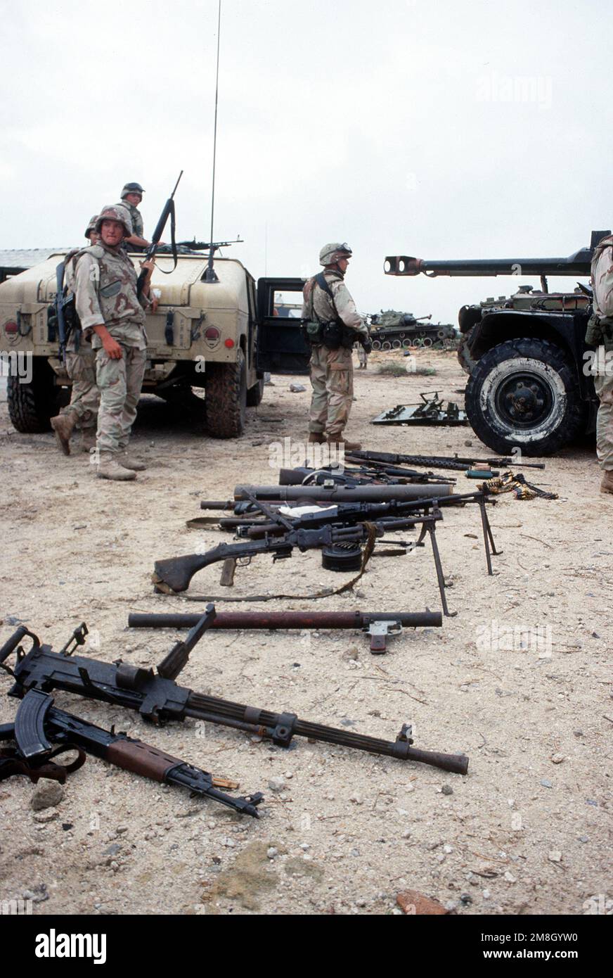 Marines display a selection of weapons confiscated during the ...