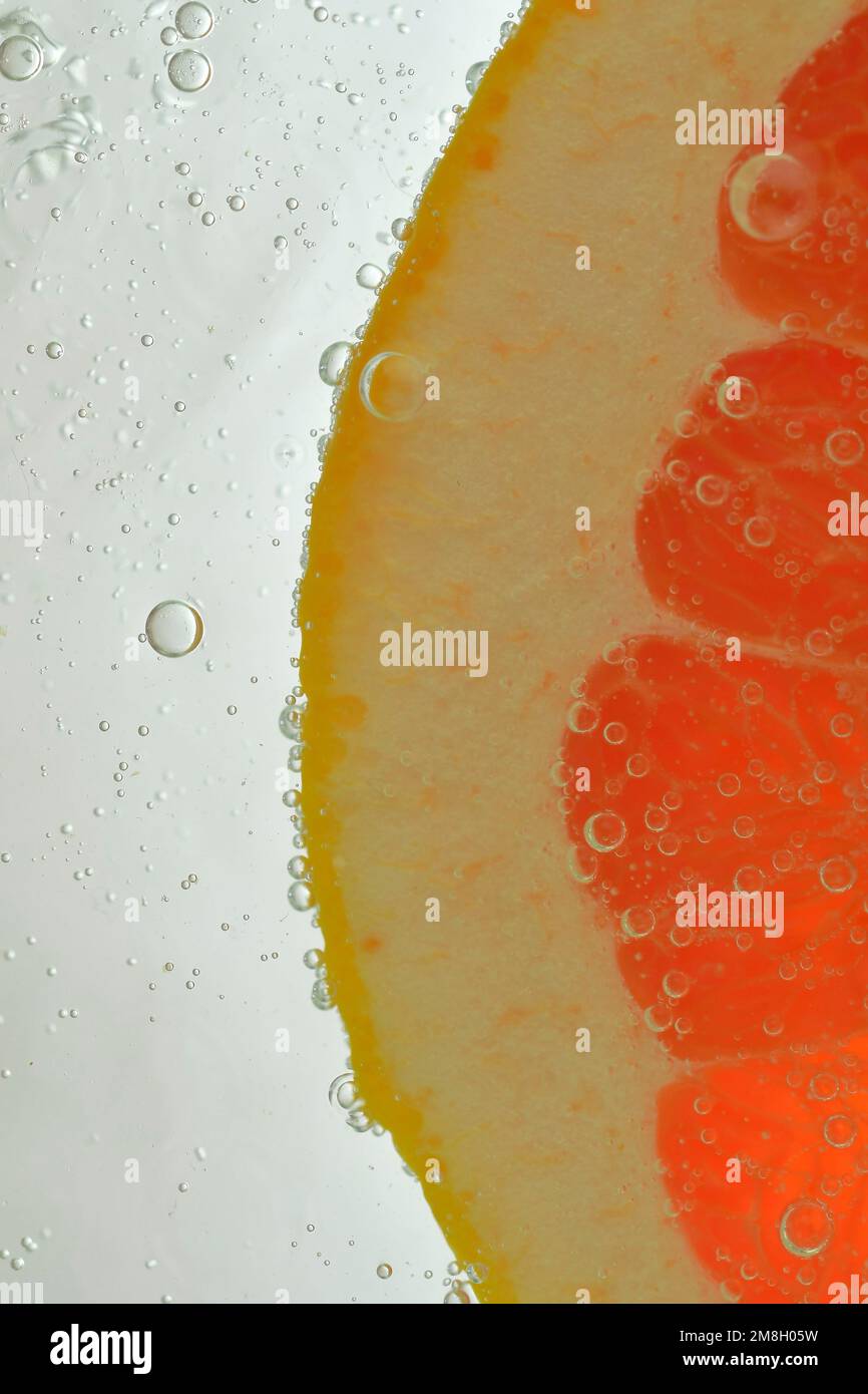 Close-up of juicy grapefruit slice on white background. Slice of red ...