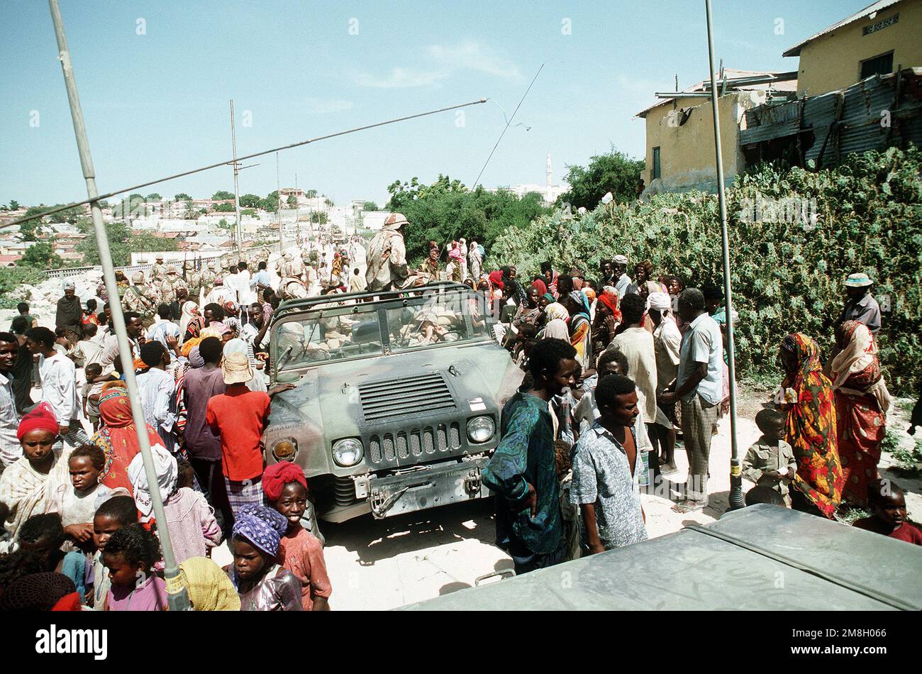 The driver of an M-1038 high-mobility multipurpose wheeled vehicle ...
