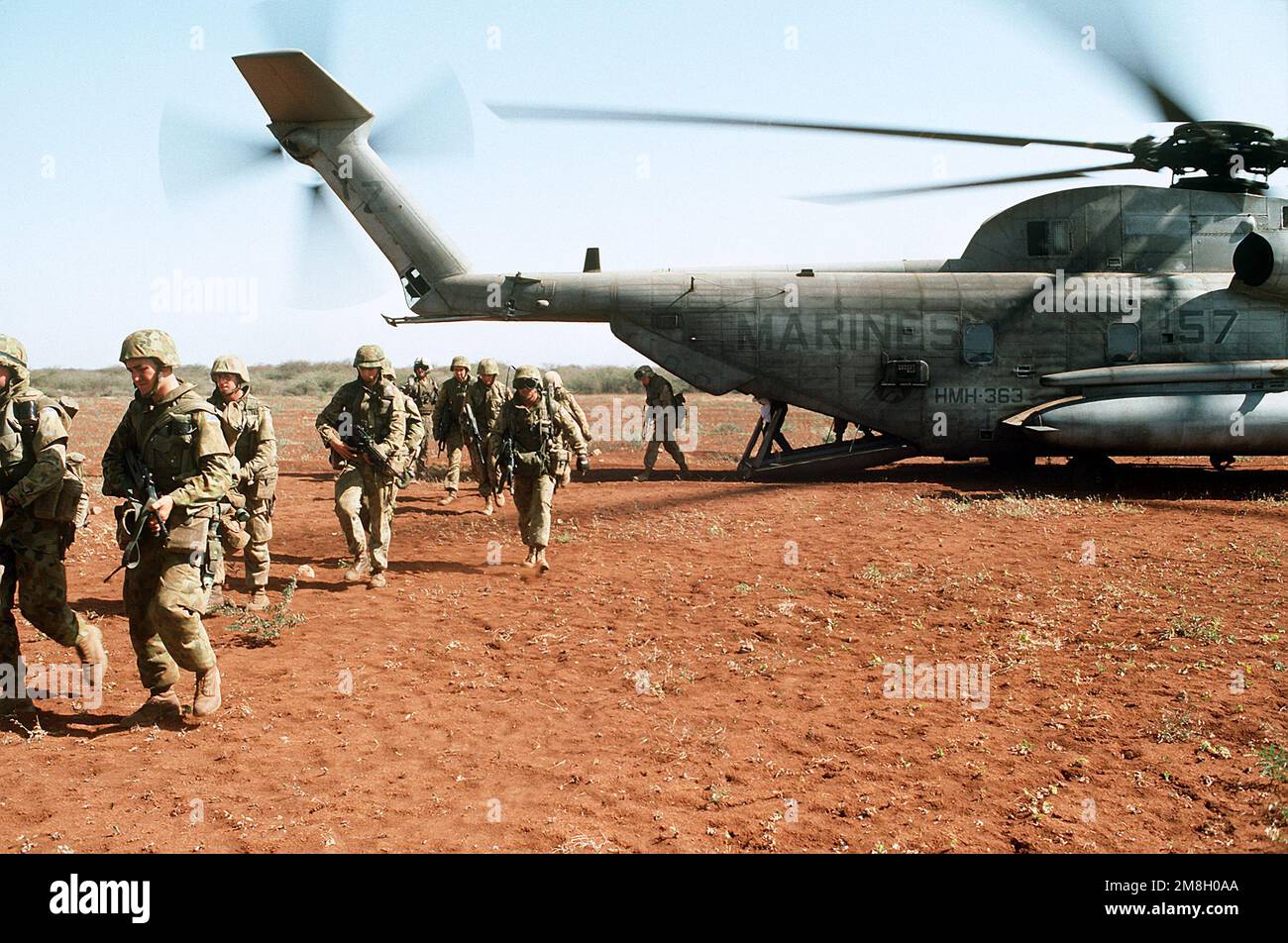 Members of the 1ST Royal Australian Regiment disembark from a Marine ...