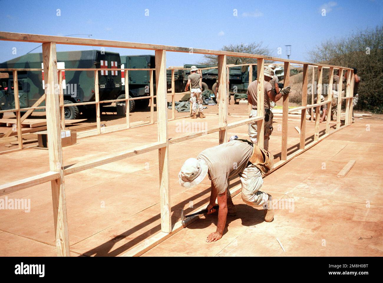 A work crew of Naval Mobile Construction Battalion 1 (NMCB-1) assembles ...