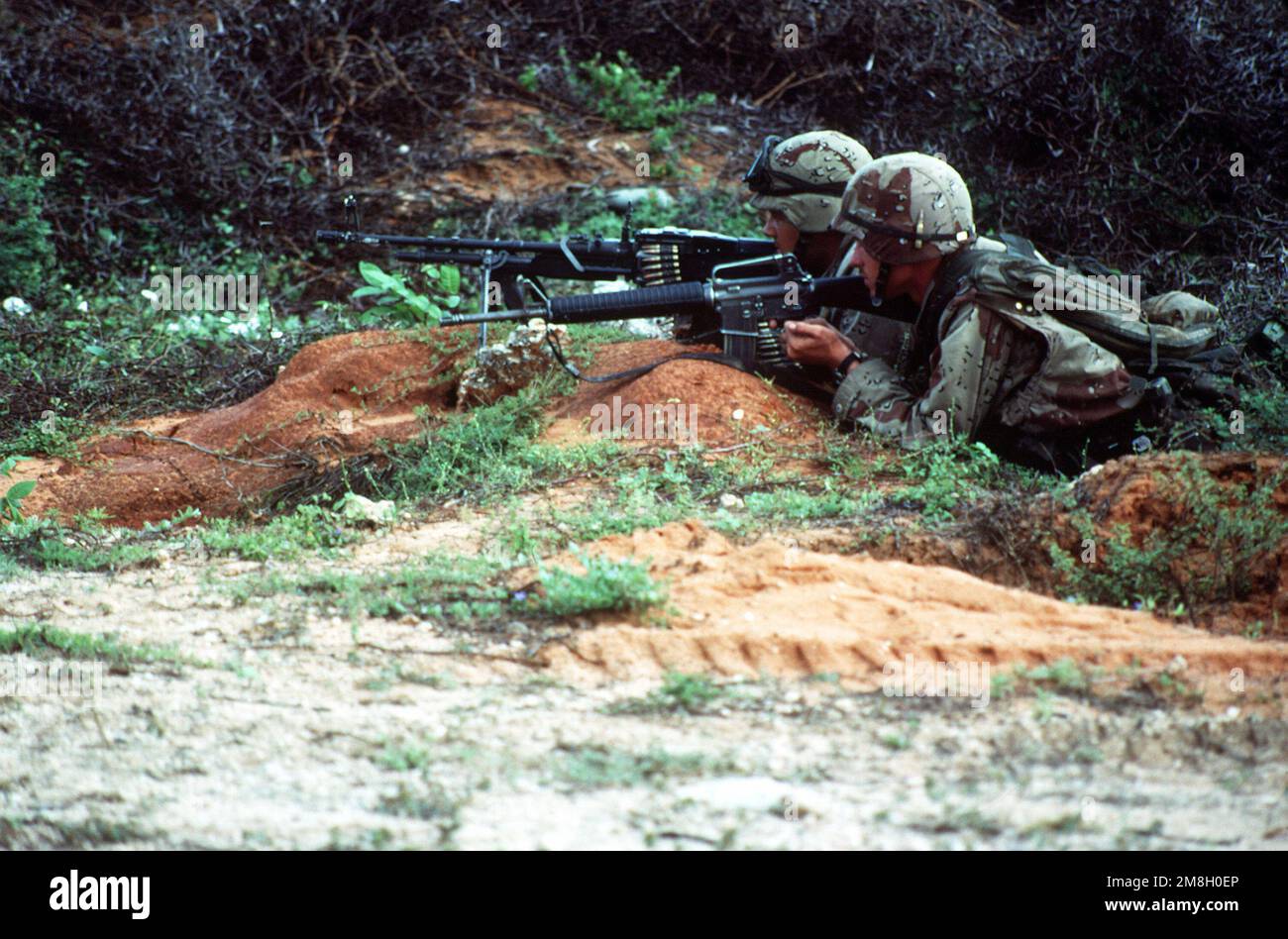 A pair of Marines from Task Force Mogadishu are ready to provide ...