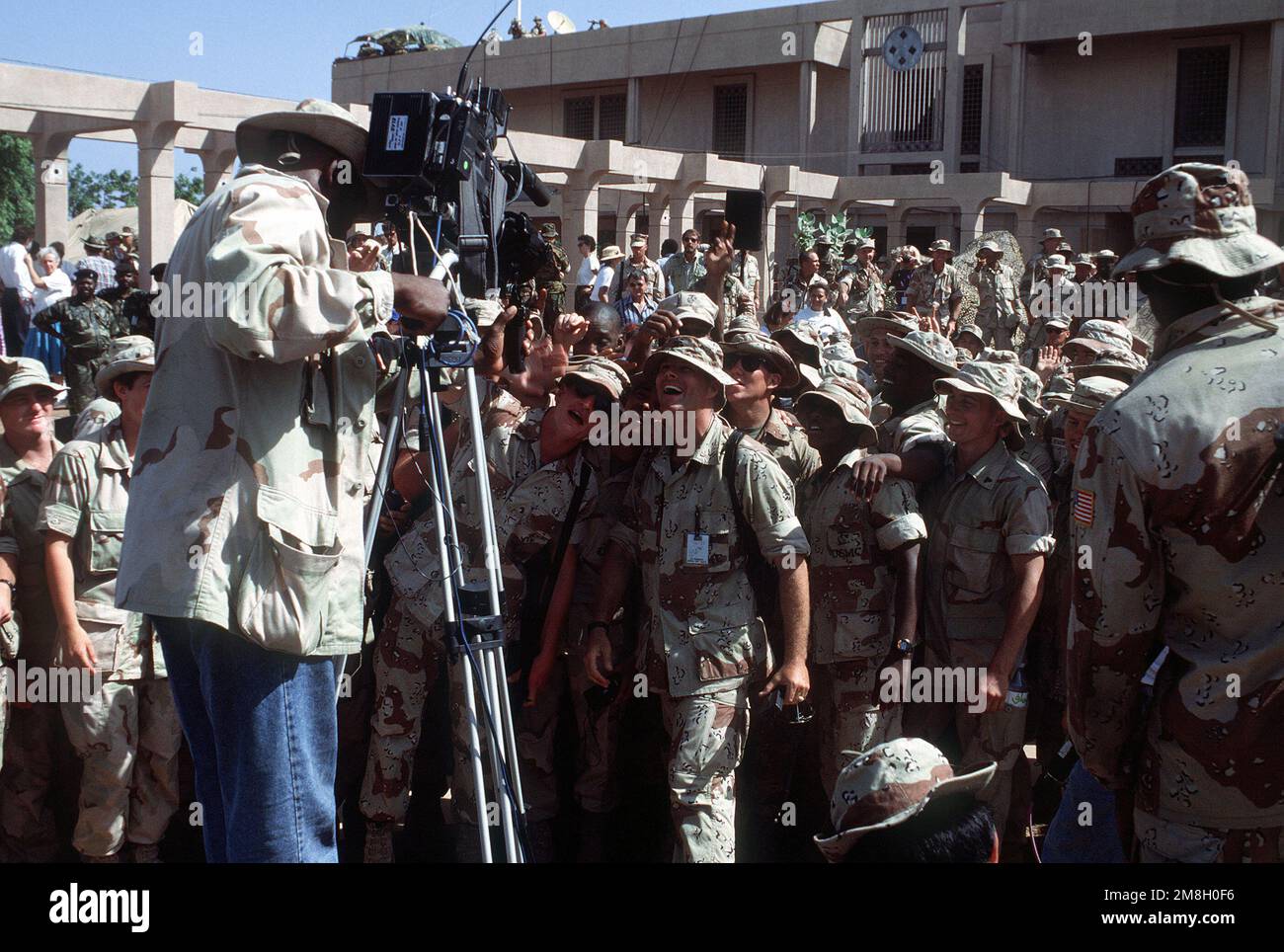 Marines gather in front of a television camera during a live broadcast ...
