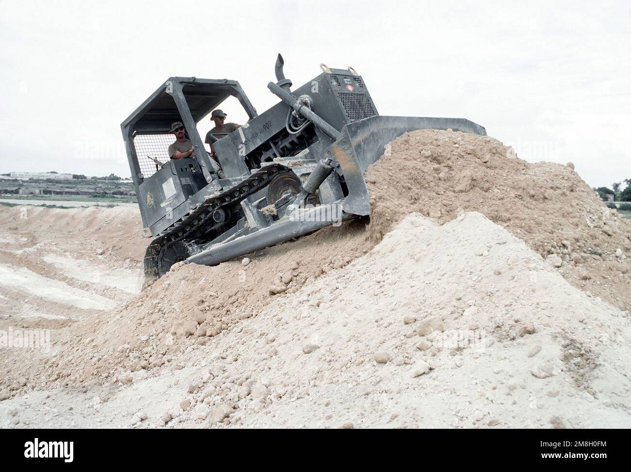 Members of Naval Mobile Construction Battalion 40 (NMCB-40) use a ...