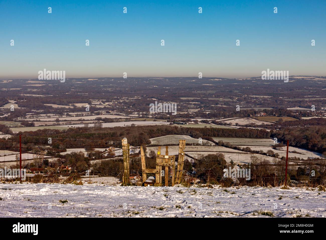 A view out over Sussex from the top of Ditchling Beacon, with snow on ...