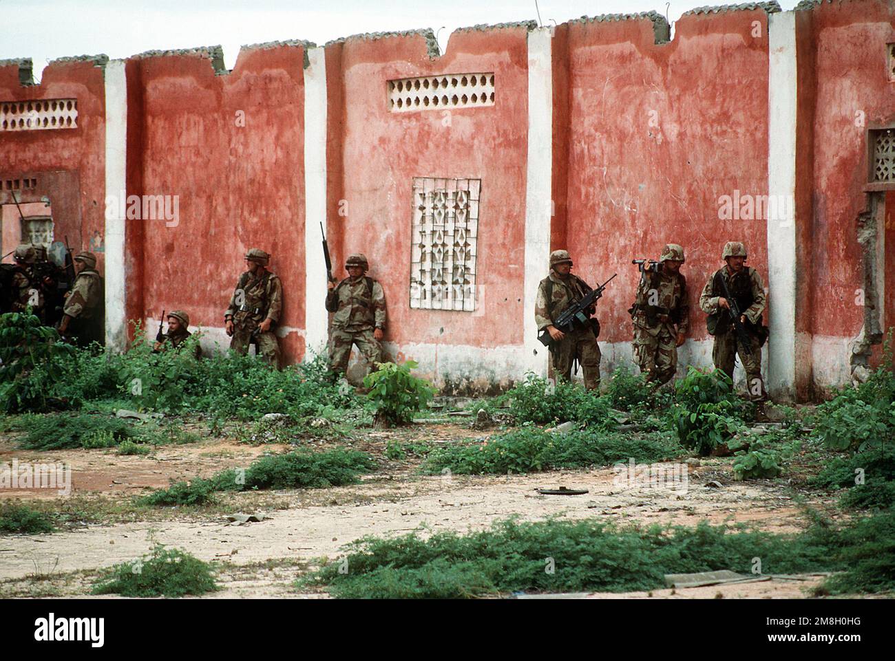 Marines of Task Force Somalia prepare to search a building for weapons ...