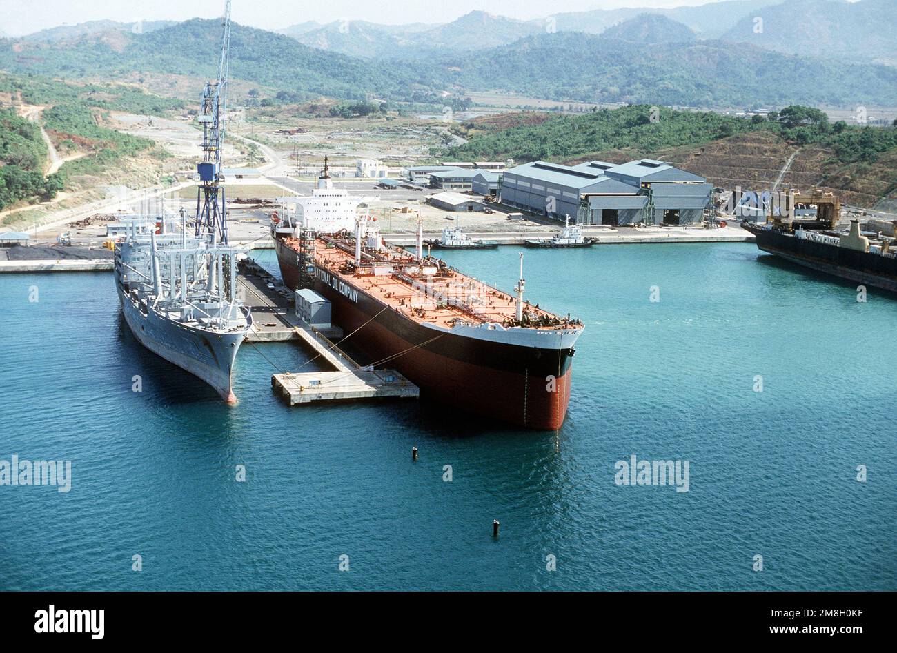 A starboard bow view of the cargo ship SANTA VICTORIA (T-AK-1010) and a ...