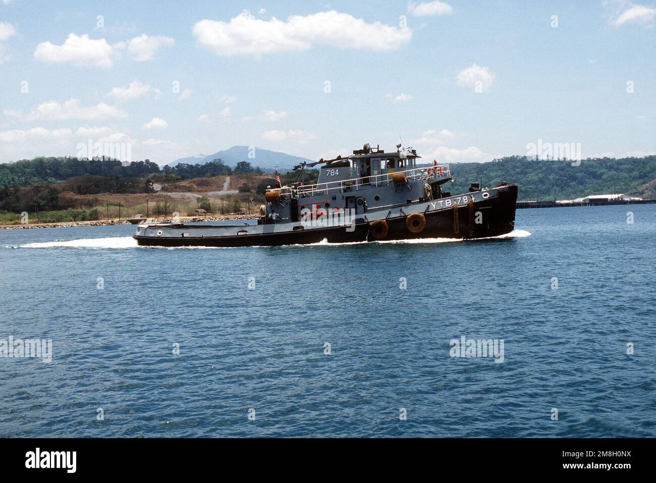 A starboard beam view of the large harbor tug KALISPELL (YTB-784 ...
