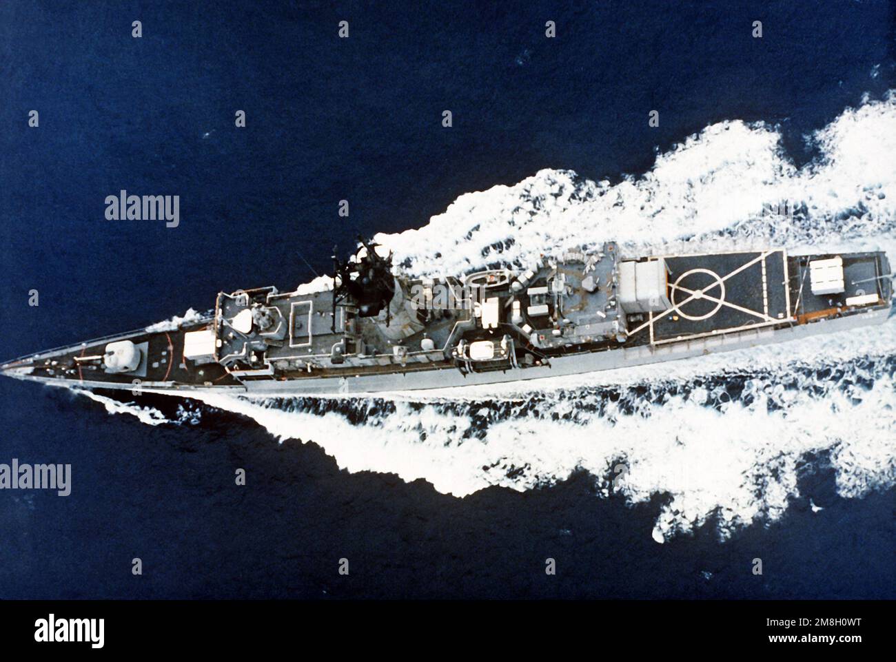 An overhead view of the frigate USS KIRK (FF-1087) underway. Base: USS ...