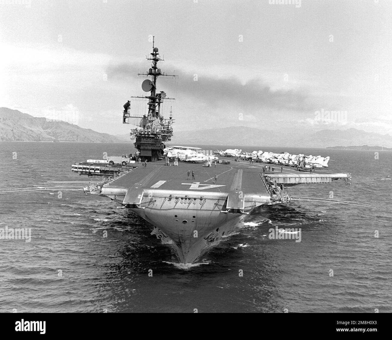 A bow view of the aircraft carrier USS MIDWAY (CV-41) underway. Base ...