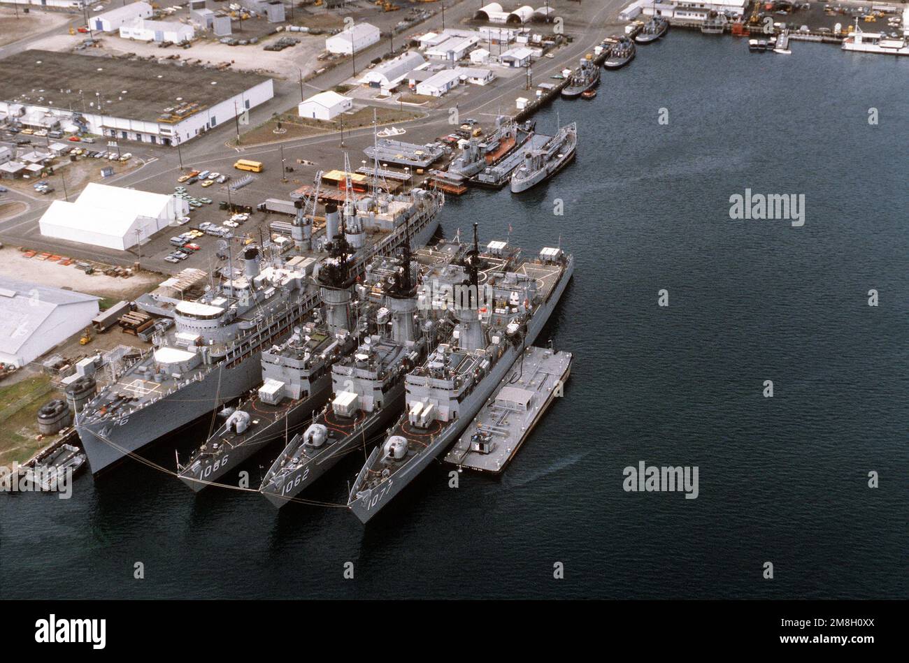 An aerial view of the repair ship USS AJAX (AR-6) moored at the Boton ...