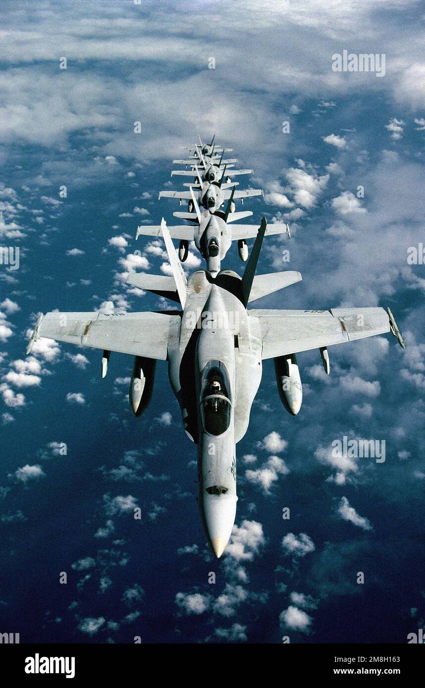 An air-to-air view of six Strike Fighter Squadron 151 (VFA-151) F/A-18A ...