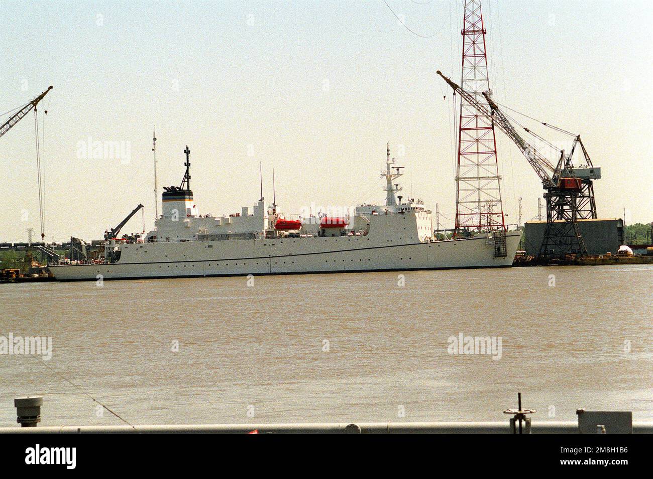 A starboard view of the surveying ship USNS WATERS (T-AGS-45) moored to ...