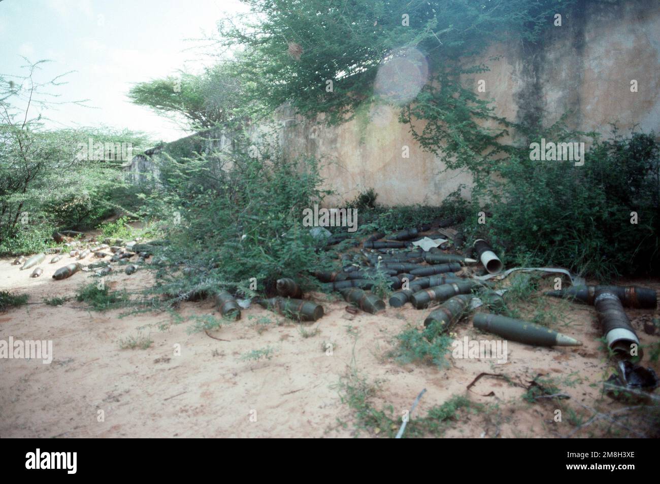 Artillery shells litter the ground outside a bunker near Afgoi. The ...