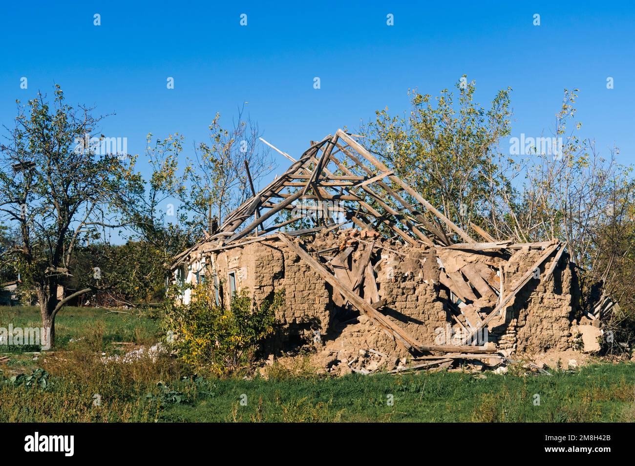 Countryside. Destroyed house after the battle. War in Ukraine. Russian ...